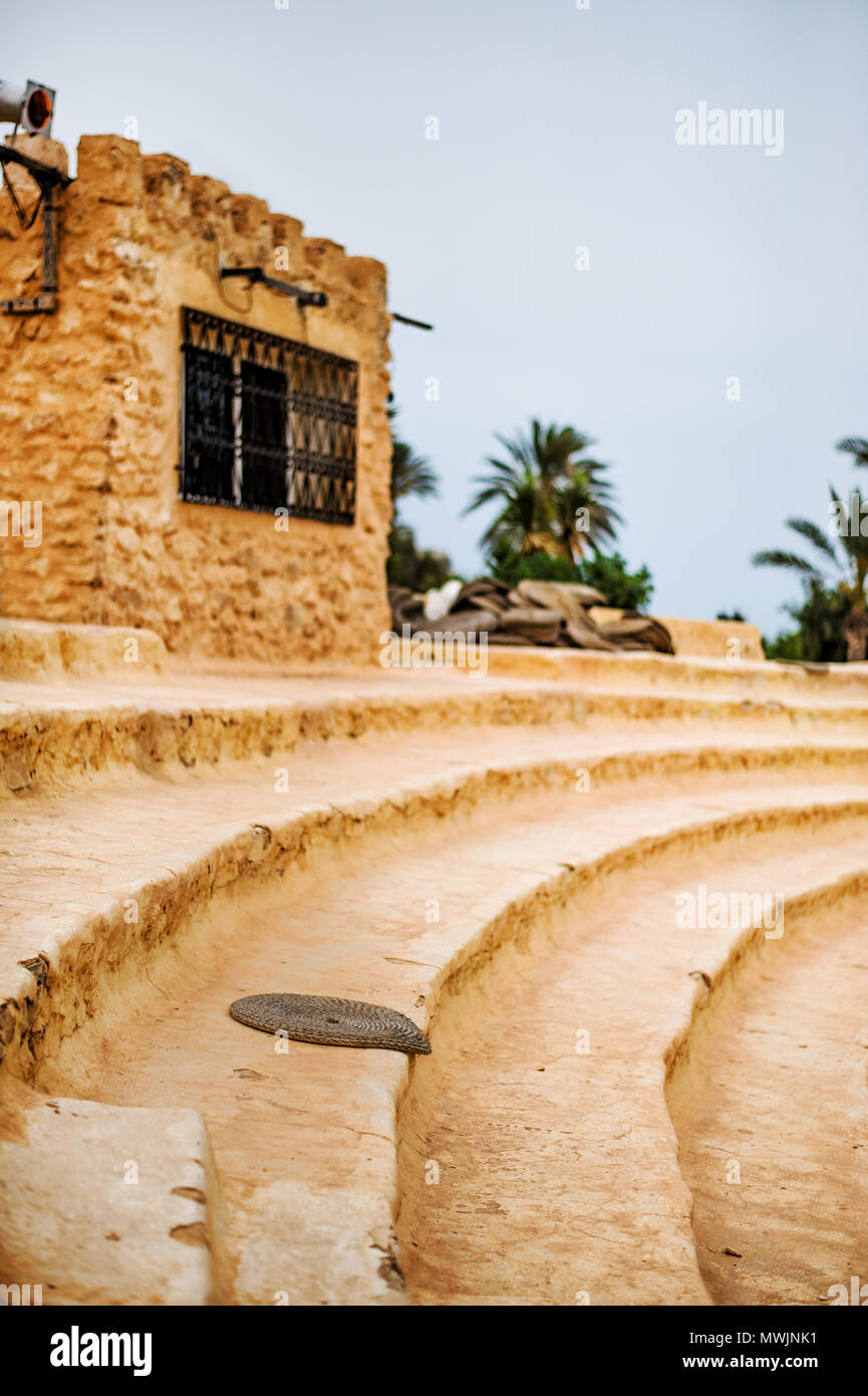 Focus on round seat. Classic An ancient amphitheater in an Arab town ...
