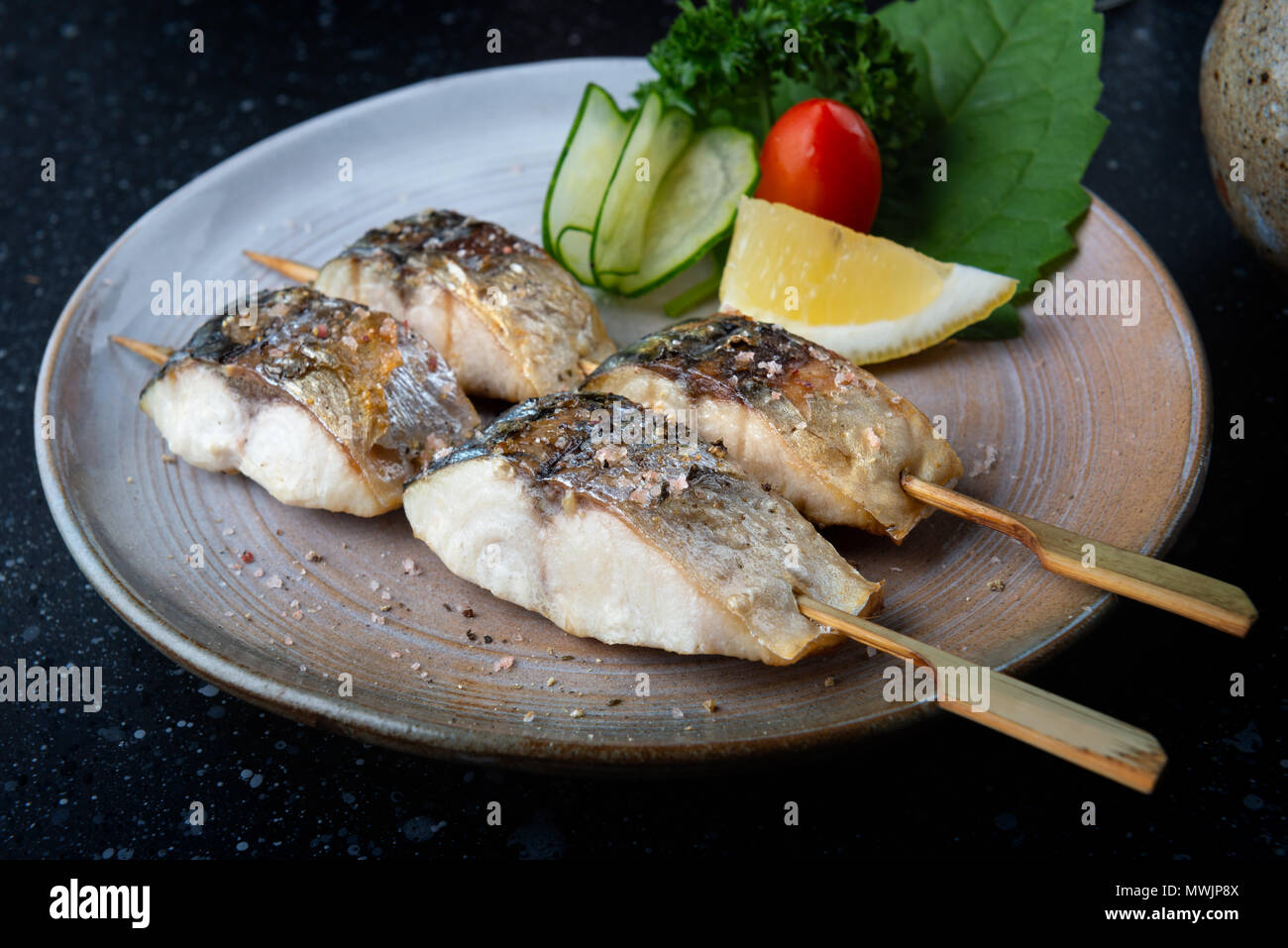 Skewer grilled saba fish with salt set and serve in Japanese style saba ...