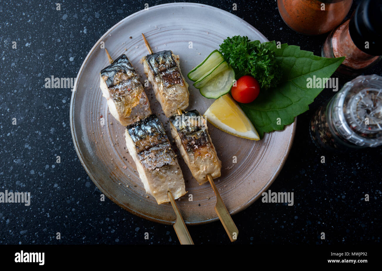 Skewer grilled saba fish with salt set and serve in Japanese style saba ...