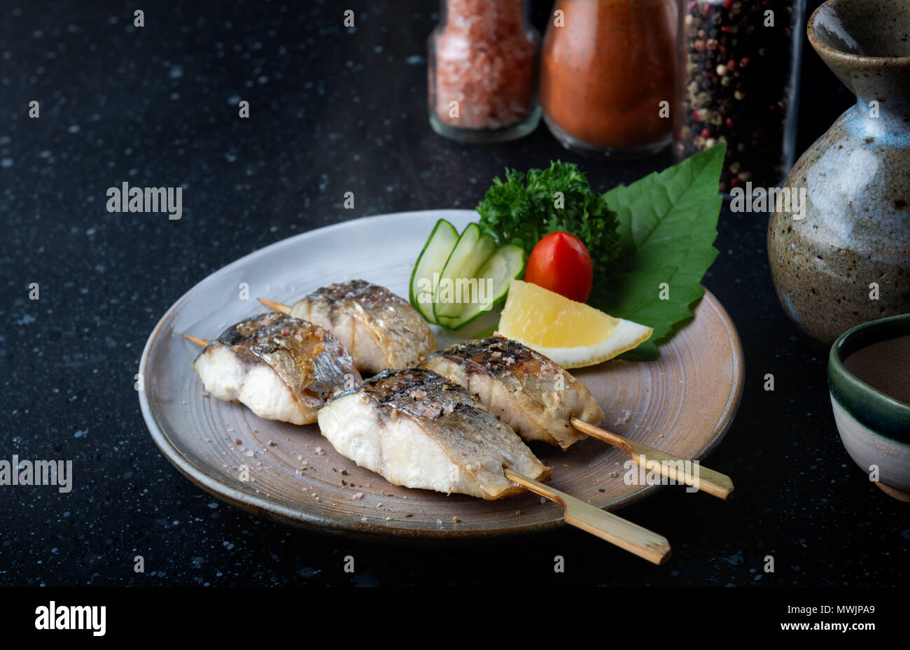 Skewer grilled saba fish with salt set and serve in Japanese style saba ...