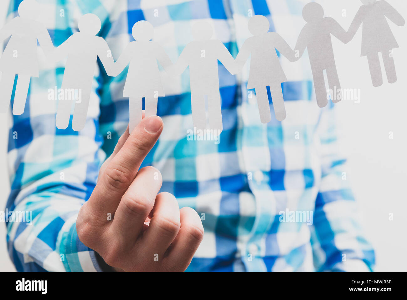 Selection of candidates for work, recruitment. The man chooses a figure ...