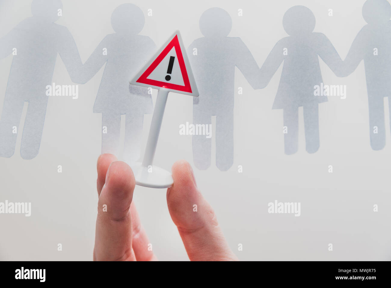 Warning for employees, couples, yellow card concept. A sign with an ...