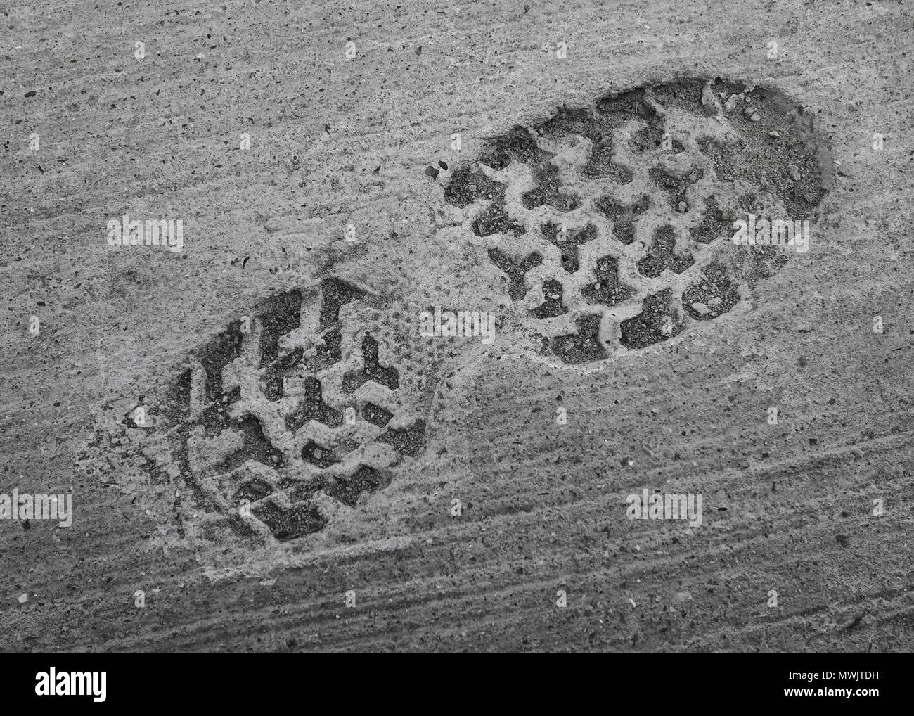 footprint in concrete Stock Photo - Alamy