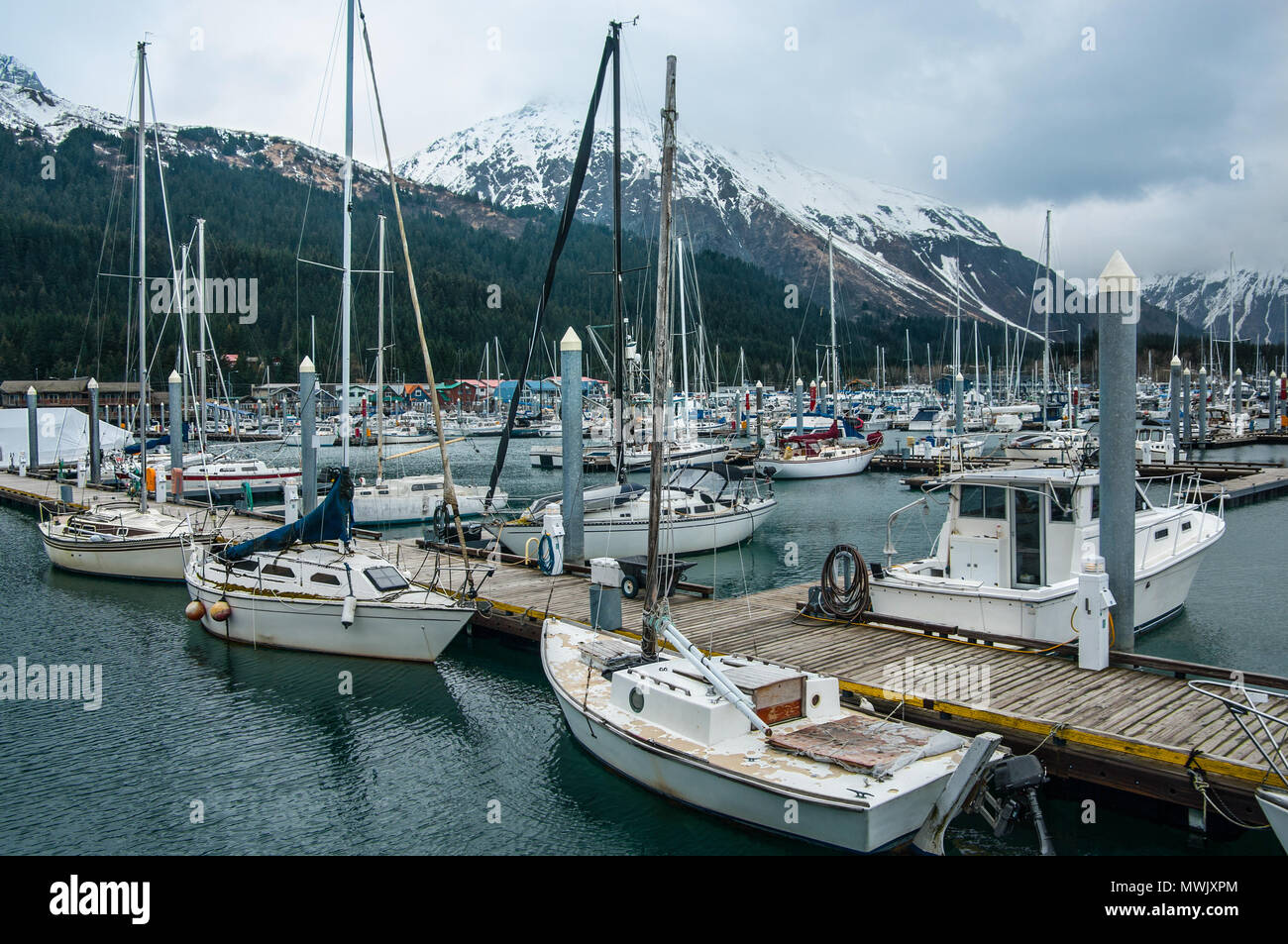 Alaska Harbor: Fishing boats and sailing yachts dock in the harbor at ...