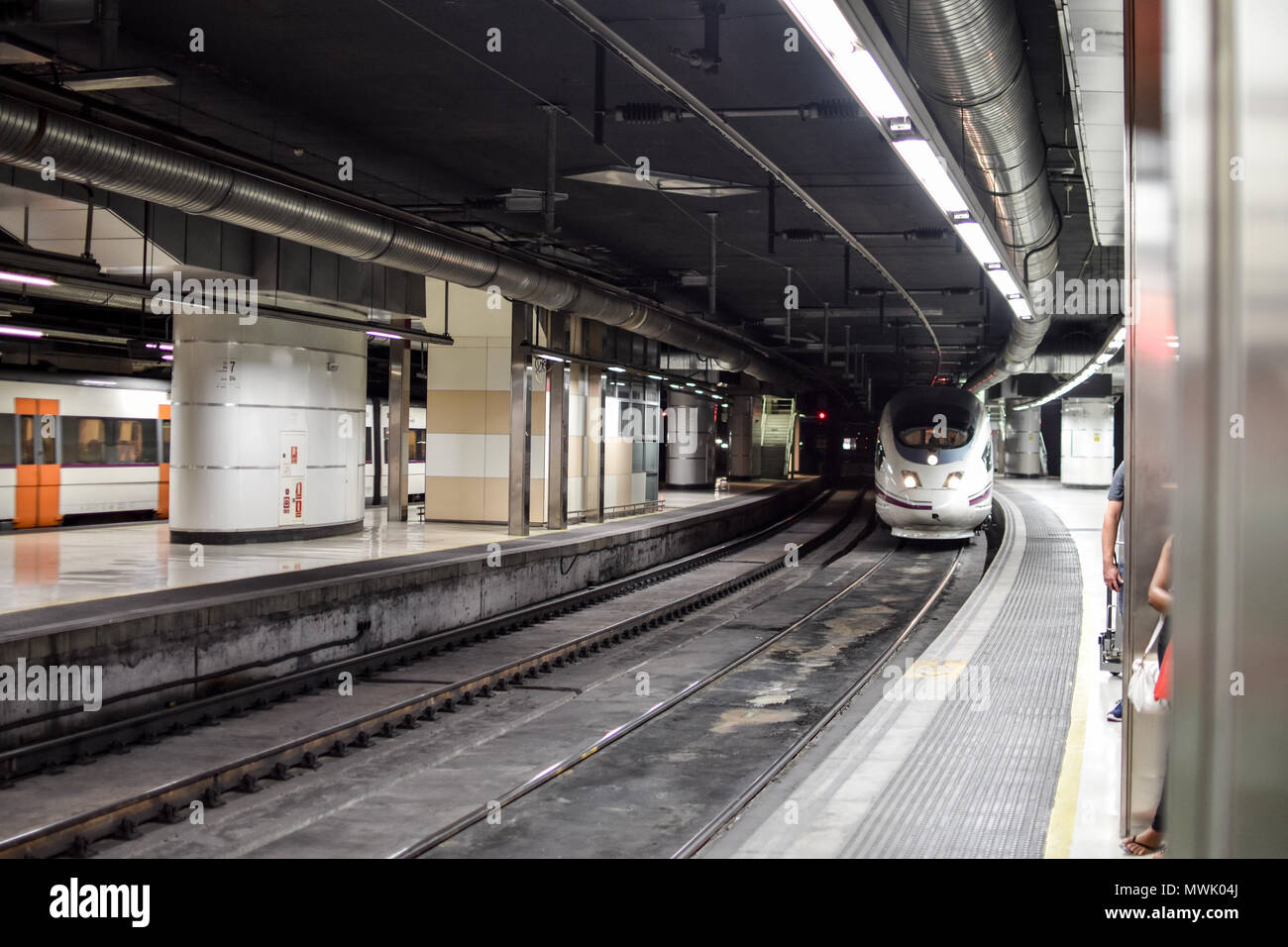 Subway train coming to a station in Barcelona, Spain Stock Photo - Alamy