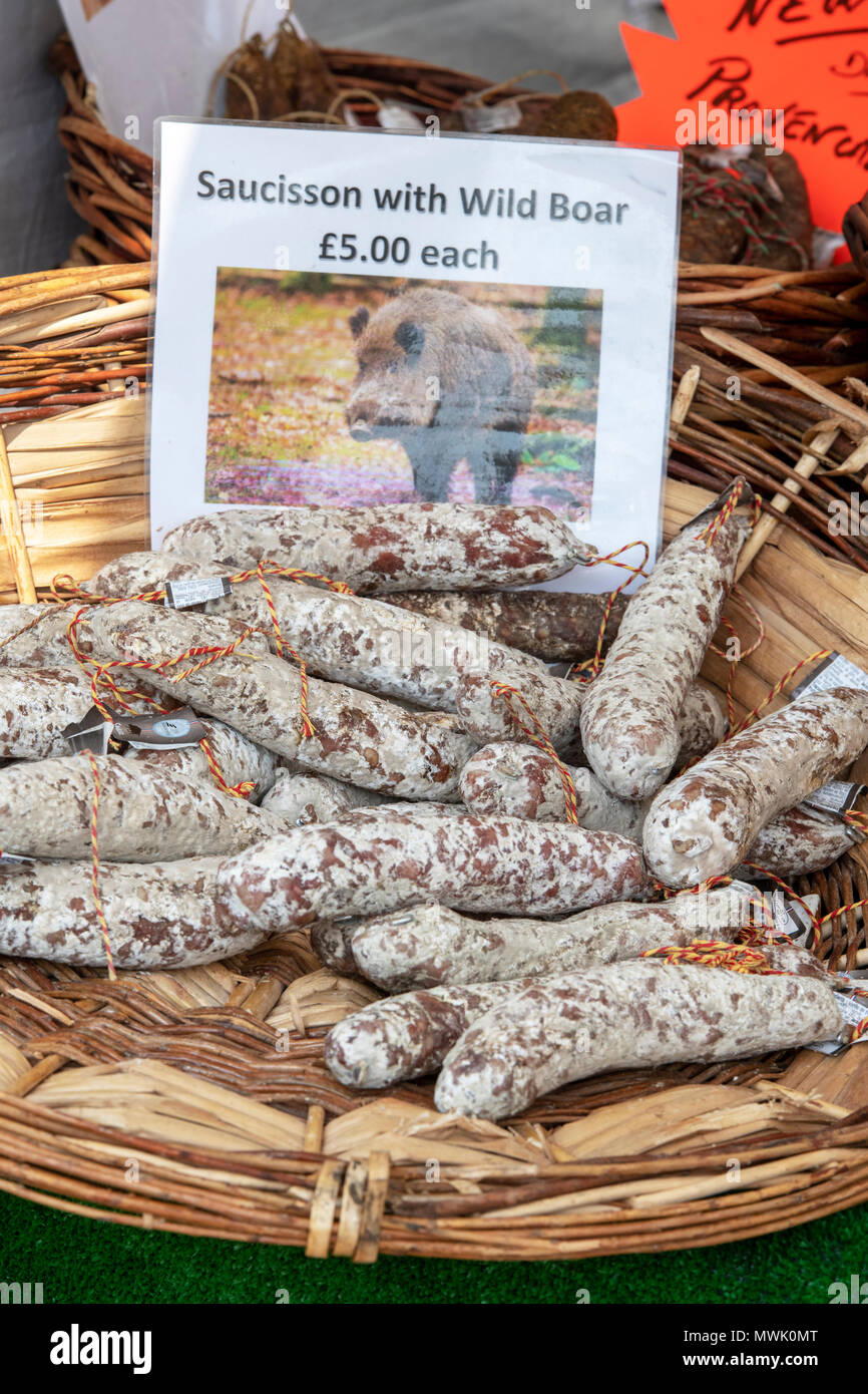 French wild boar dry cured sausage. Artisan saucisson with wild boar on ...