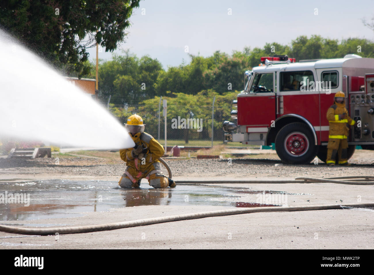 Firefighter fighting For A Fire Attack, During A Training Exercise ...