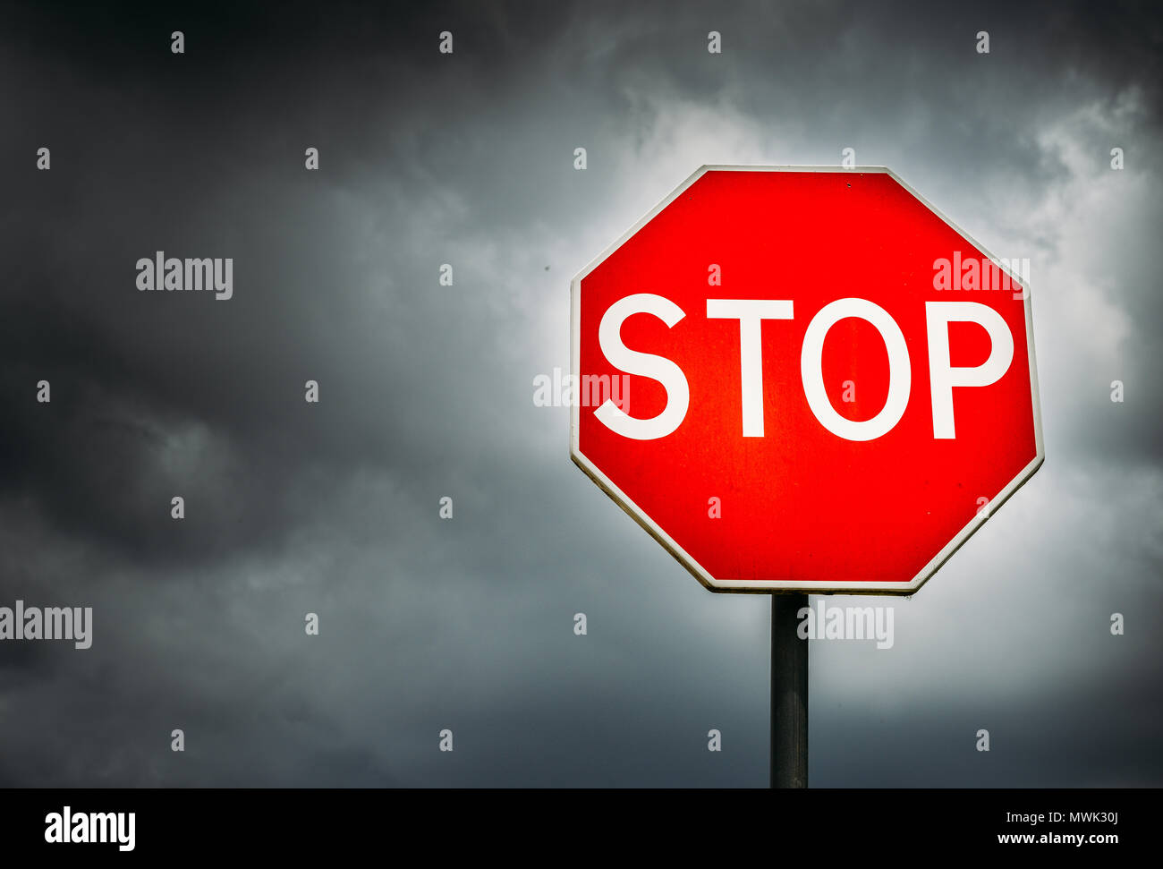 Conceptual stop sign with stormy background and copy space Stock Photo ...
