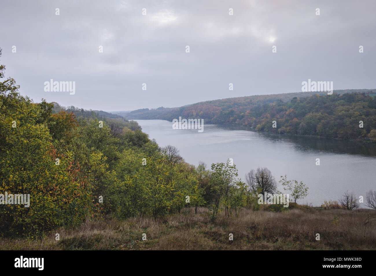 Thick clouds over the river, cloudy weather Stock Photo - Alamy