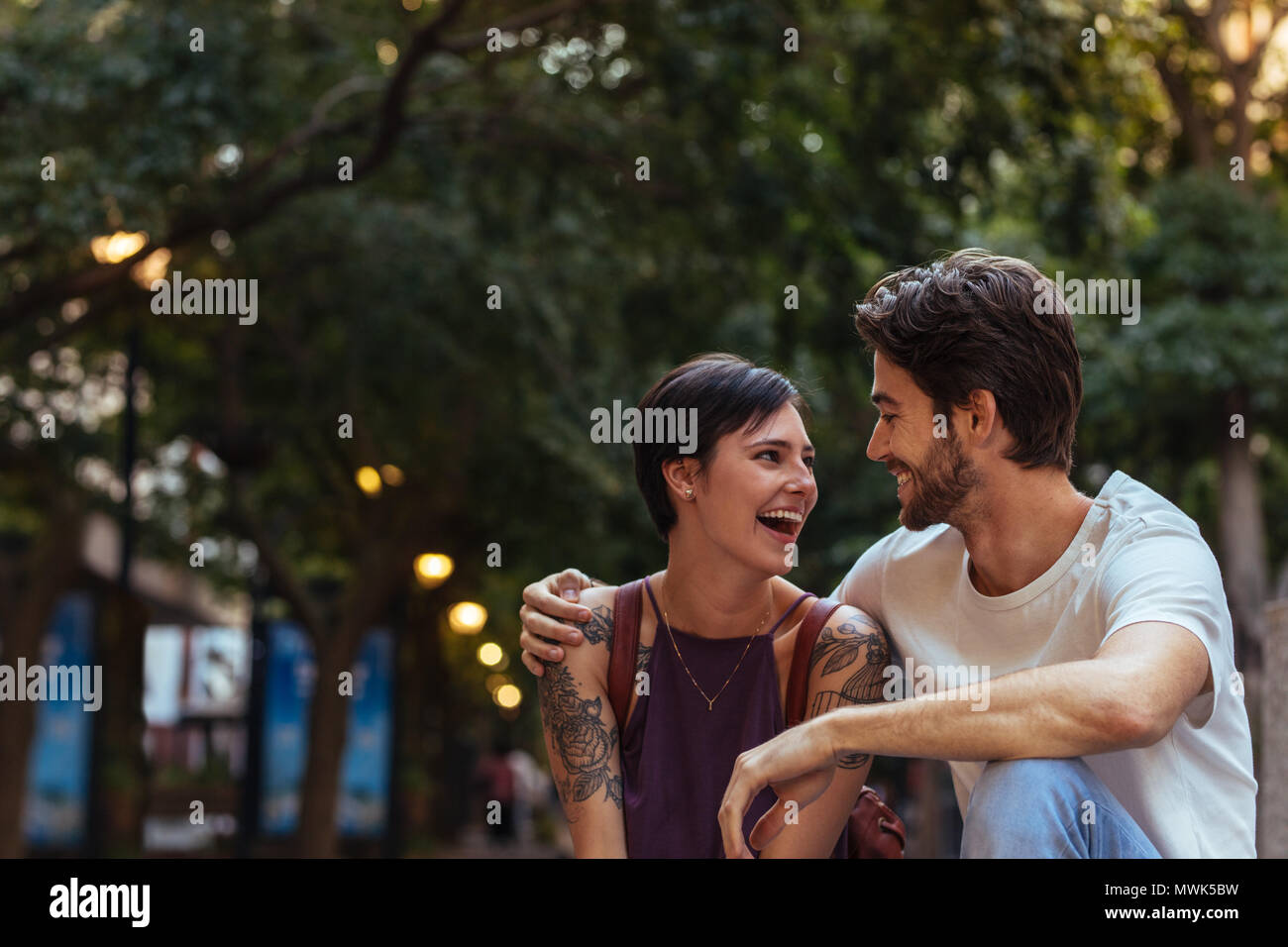 Man arm around woman hi-res stock photography and images - Alamy