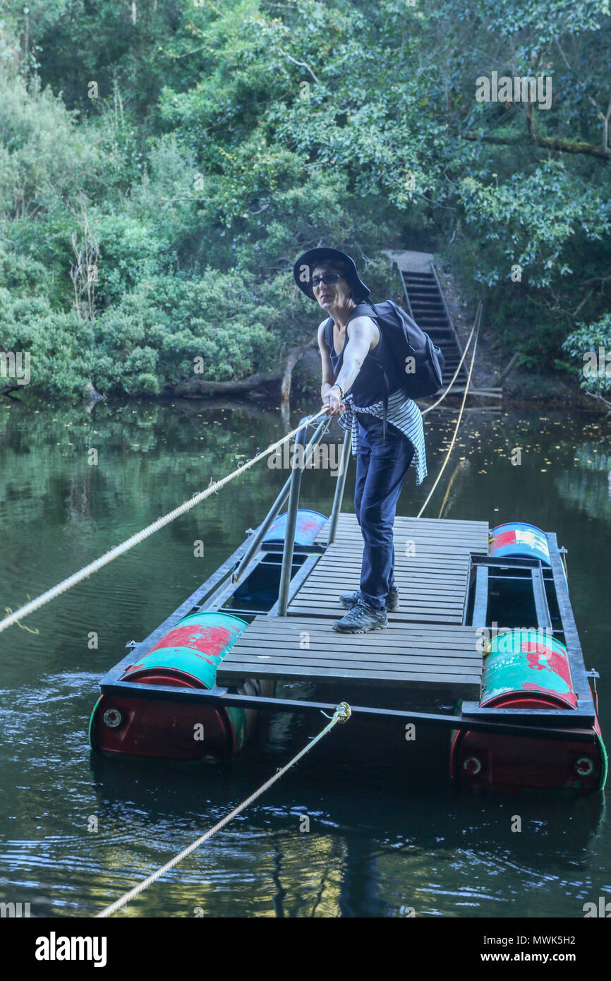 middle aged lady adventurer on a pontoon in the wilderness national ...