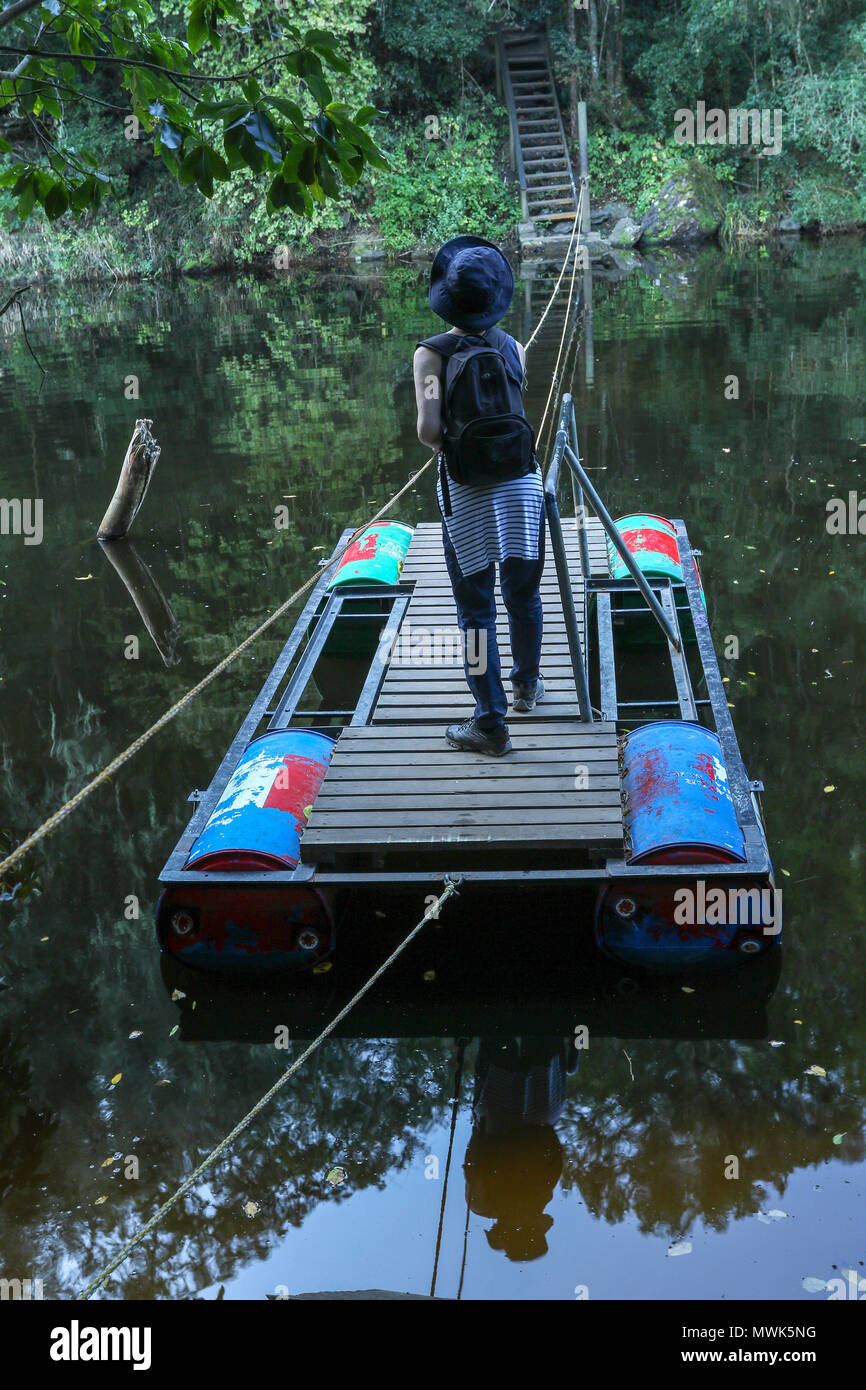 middle aged lady adventurer on a pontoon in the wilderness national ...