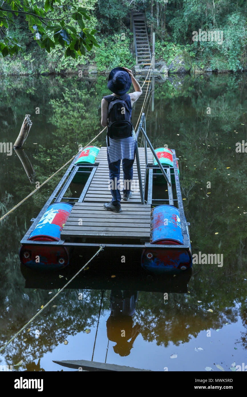 middle aged lady adventurer on a pontoon in the wilderness national ...