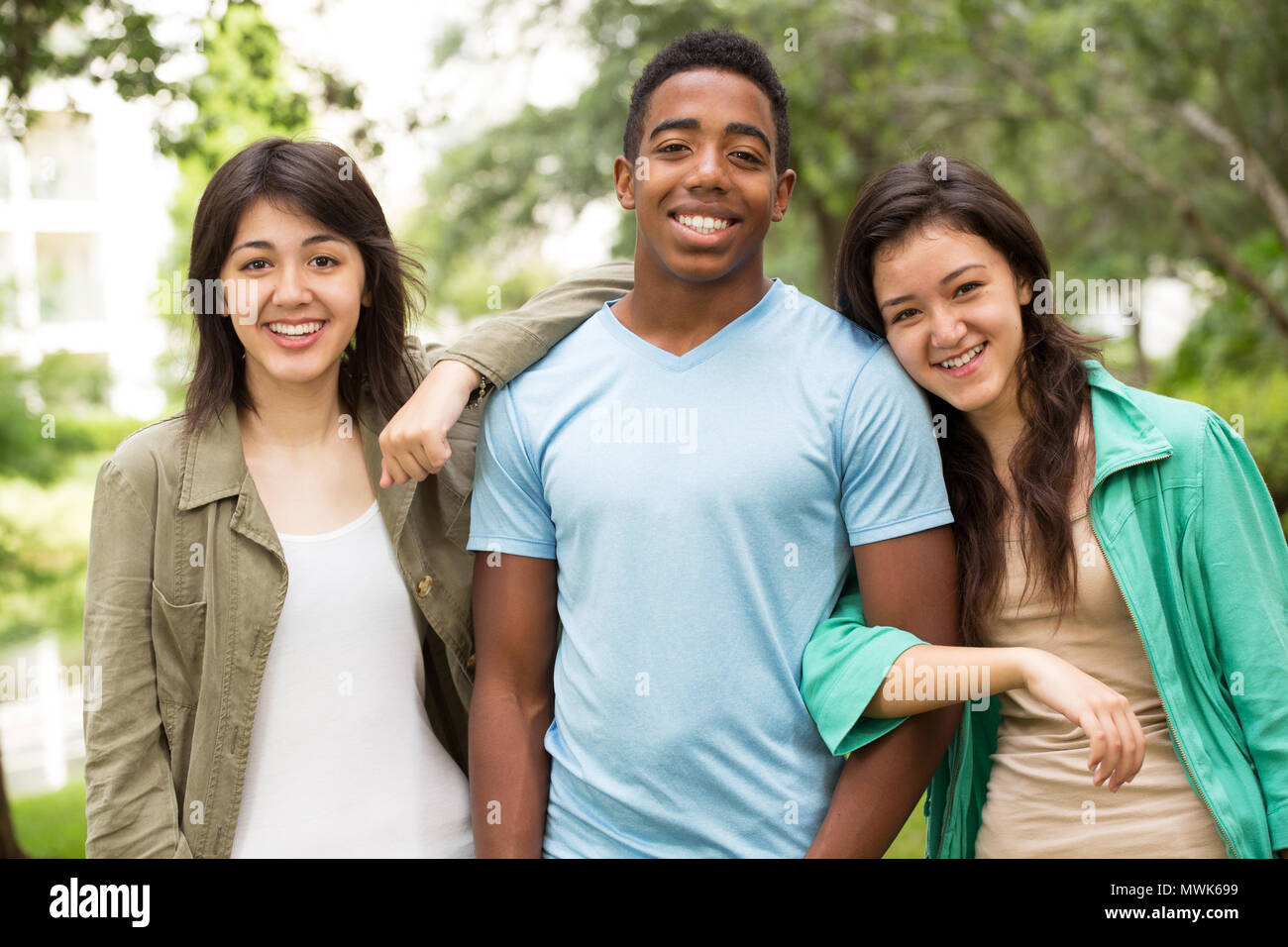 Diverse group of friends talking and laughing Stock Photo - Alamy