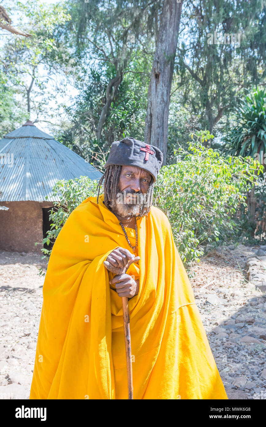 Lake Tana, Ethiopia - February 12, 2015: Priest walking with cane in ...