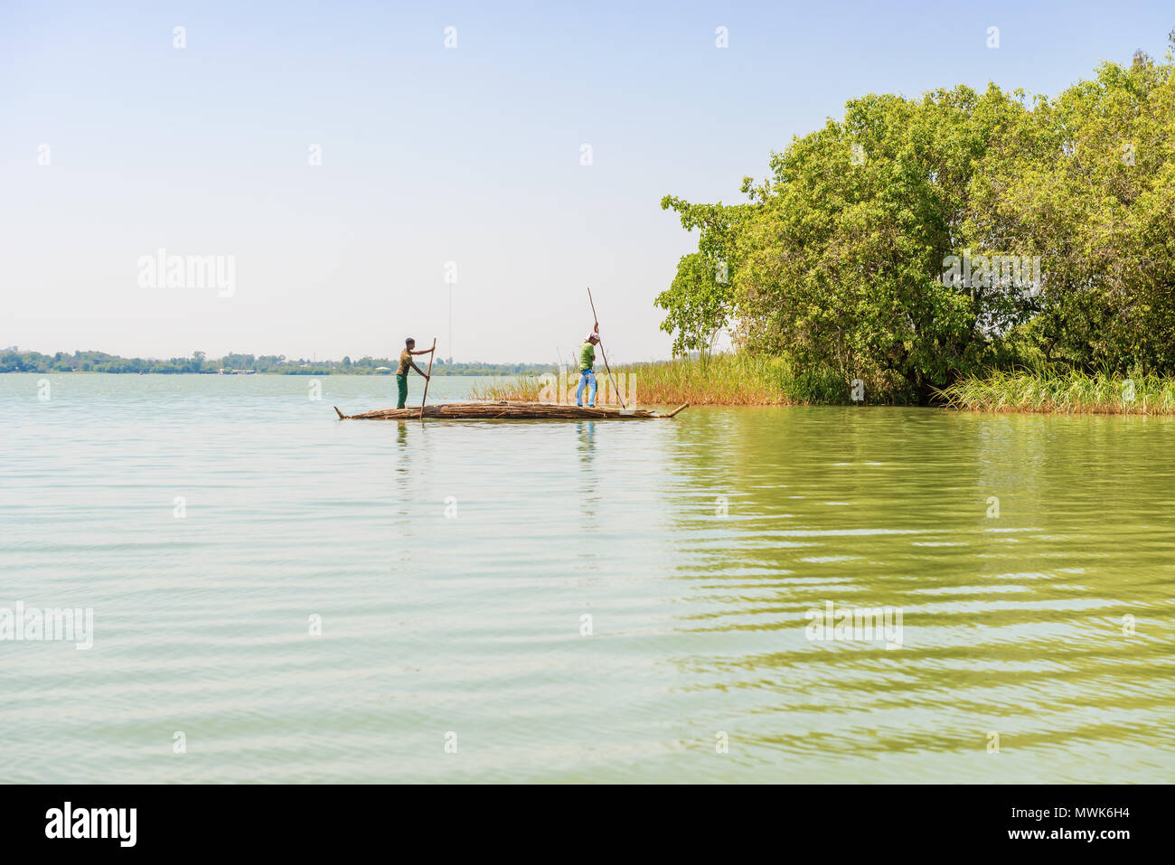 Lake Tana, Ethiopia - February 12, 2015: Two Ethiopian man rowing on ...