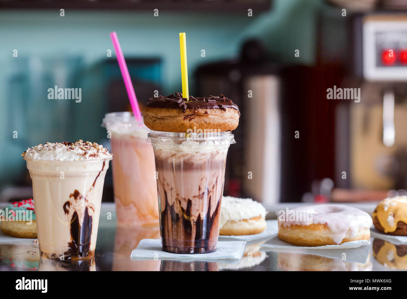 Milkshakes with donuts for takeaway in a cafe Stock Photo - Alamy