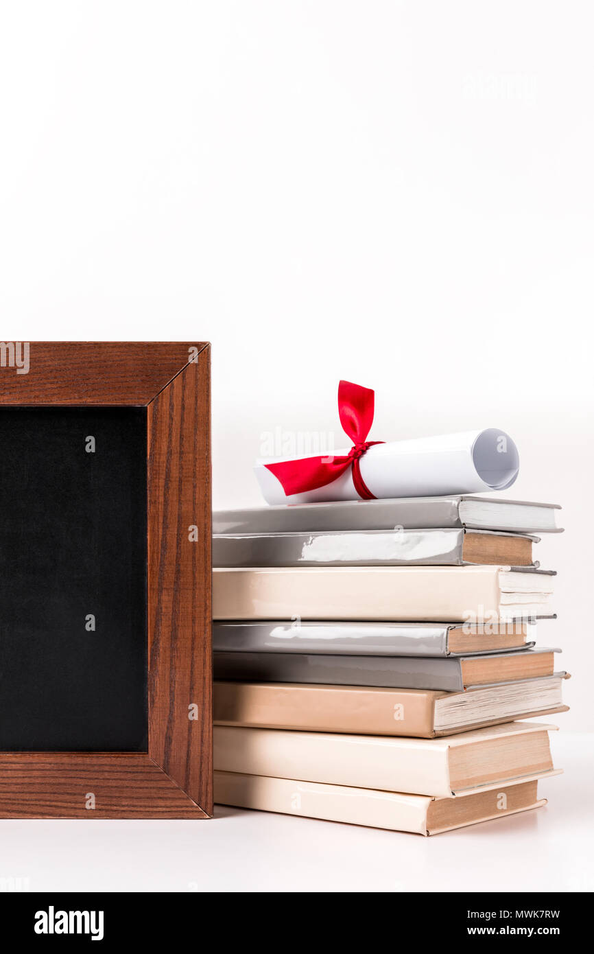 Diploma on stack of books with empty blackboard isolated on white Stock ...