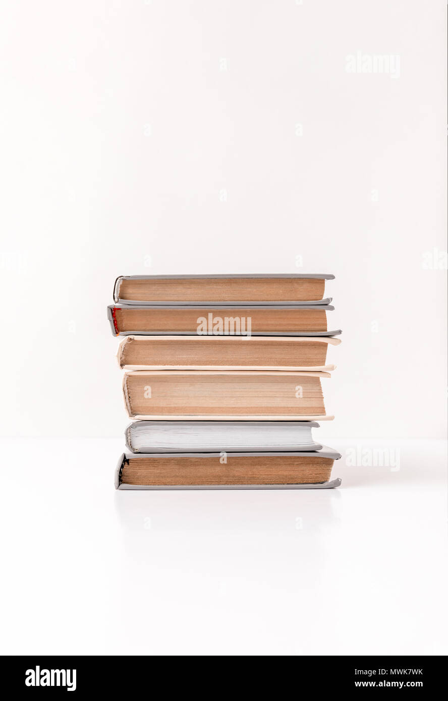 Front view of stack of different books isolated on white Stock Photo ...