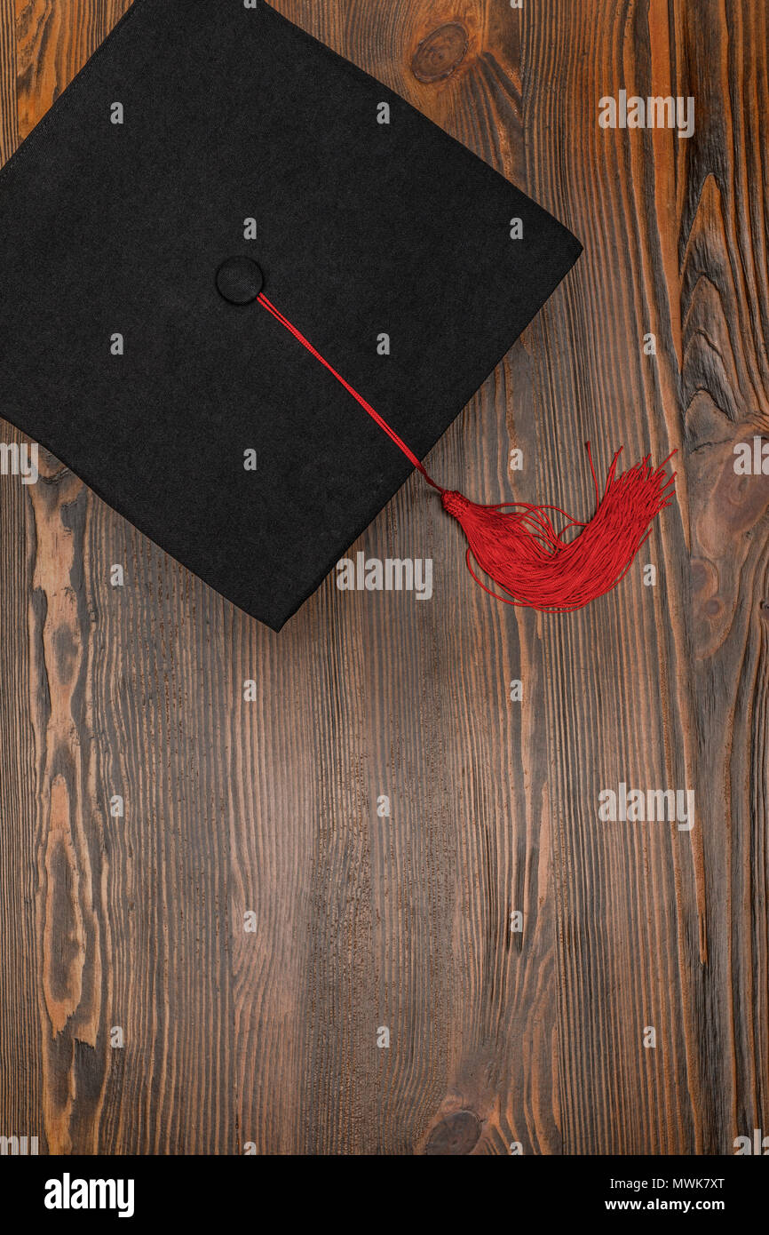 Top view of square academic cap on wood background Stock Photo - Alamy