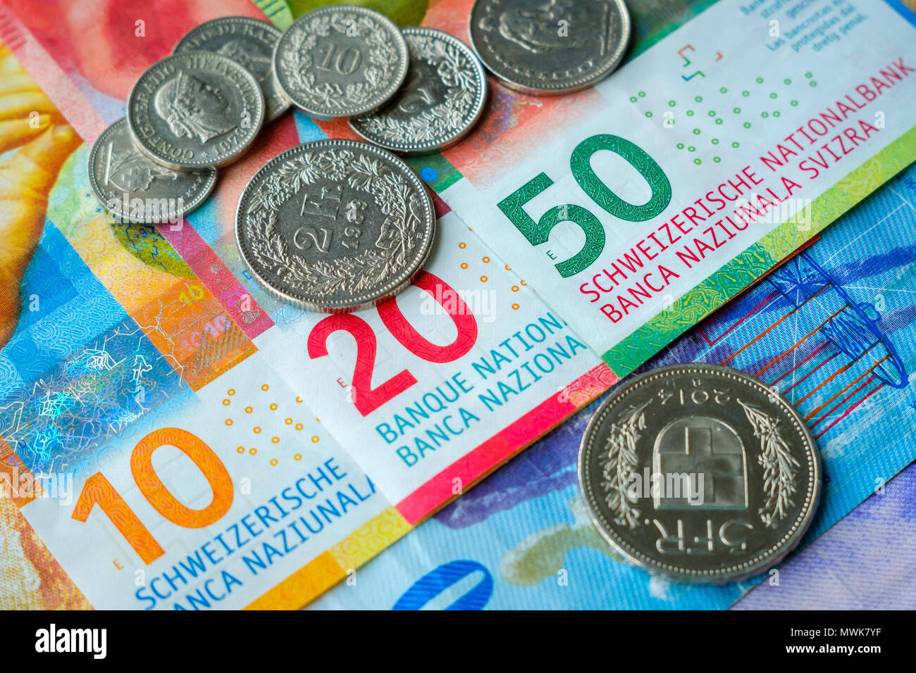 Swiss money banknotes and coins Stock Photo - Alamy
