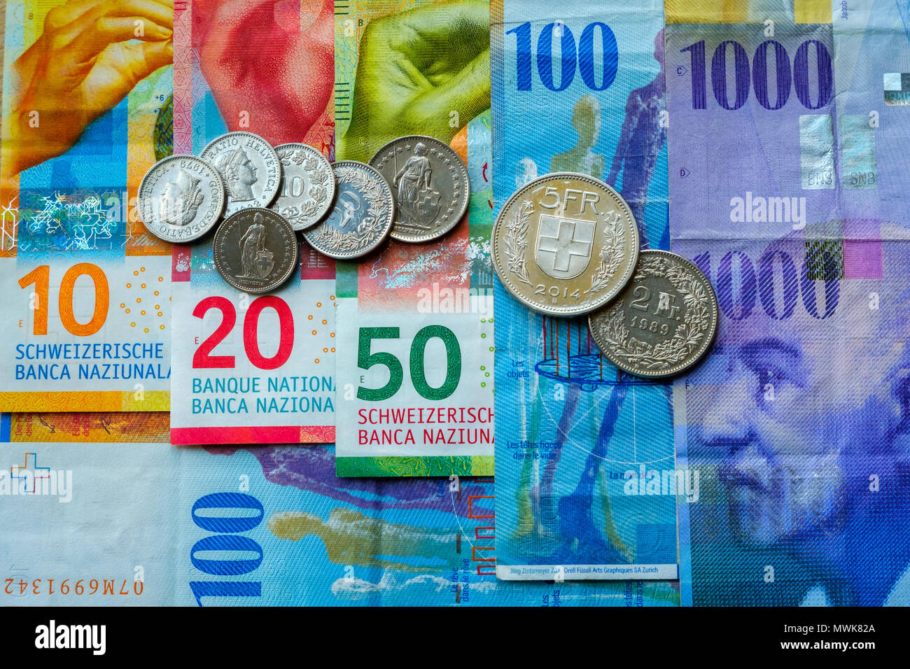 Swiss money banknotes and coins Stock Photo - Alamy