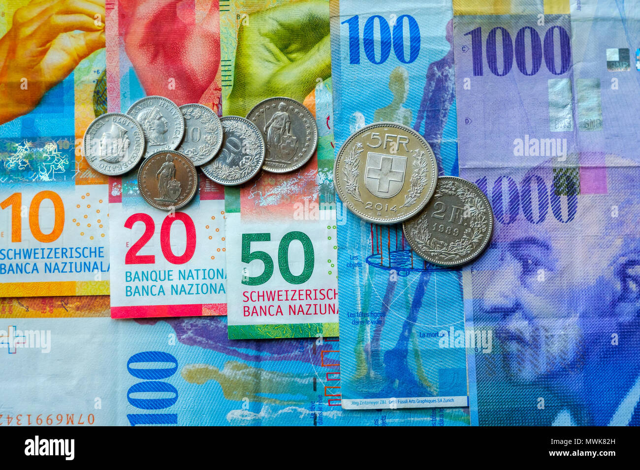 Swiss money banknotes and coins Stock Photo - Alamy