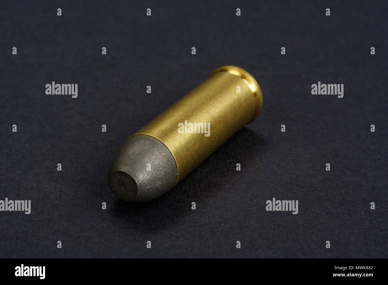 The .45 caliber revolver cartridges on black background Stock Photo - Alamy