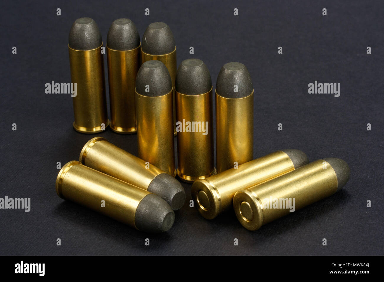 The .45 caliber revolver cartridges on black background Stock Photo - Alamy