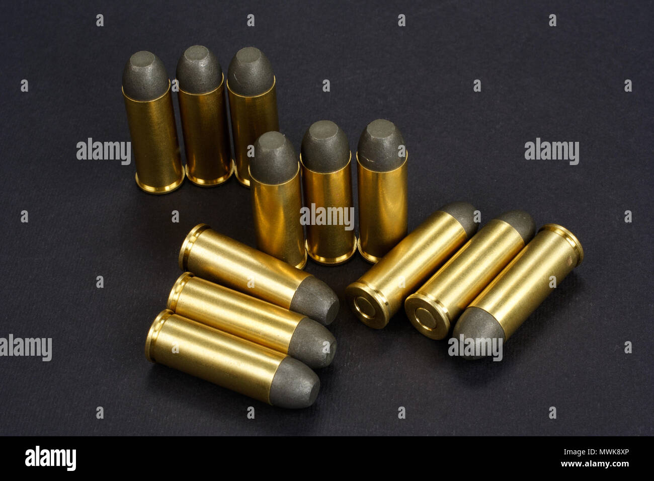 The .45 caliber revolver cartridges on black background Stock Photo - Alamy