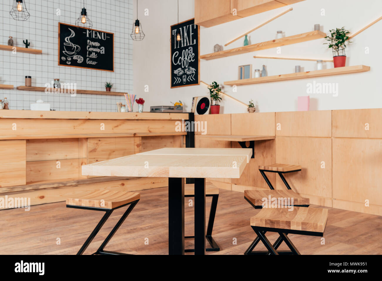 stylish interior of modern cafe with stylish wooden furniture Stock ...