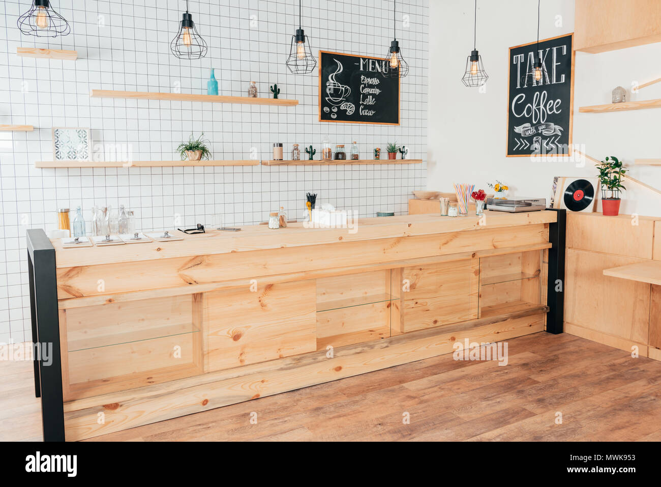 wooden bar counter of modern cafe decorated with white tiles Stock ...