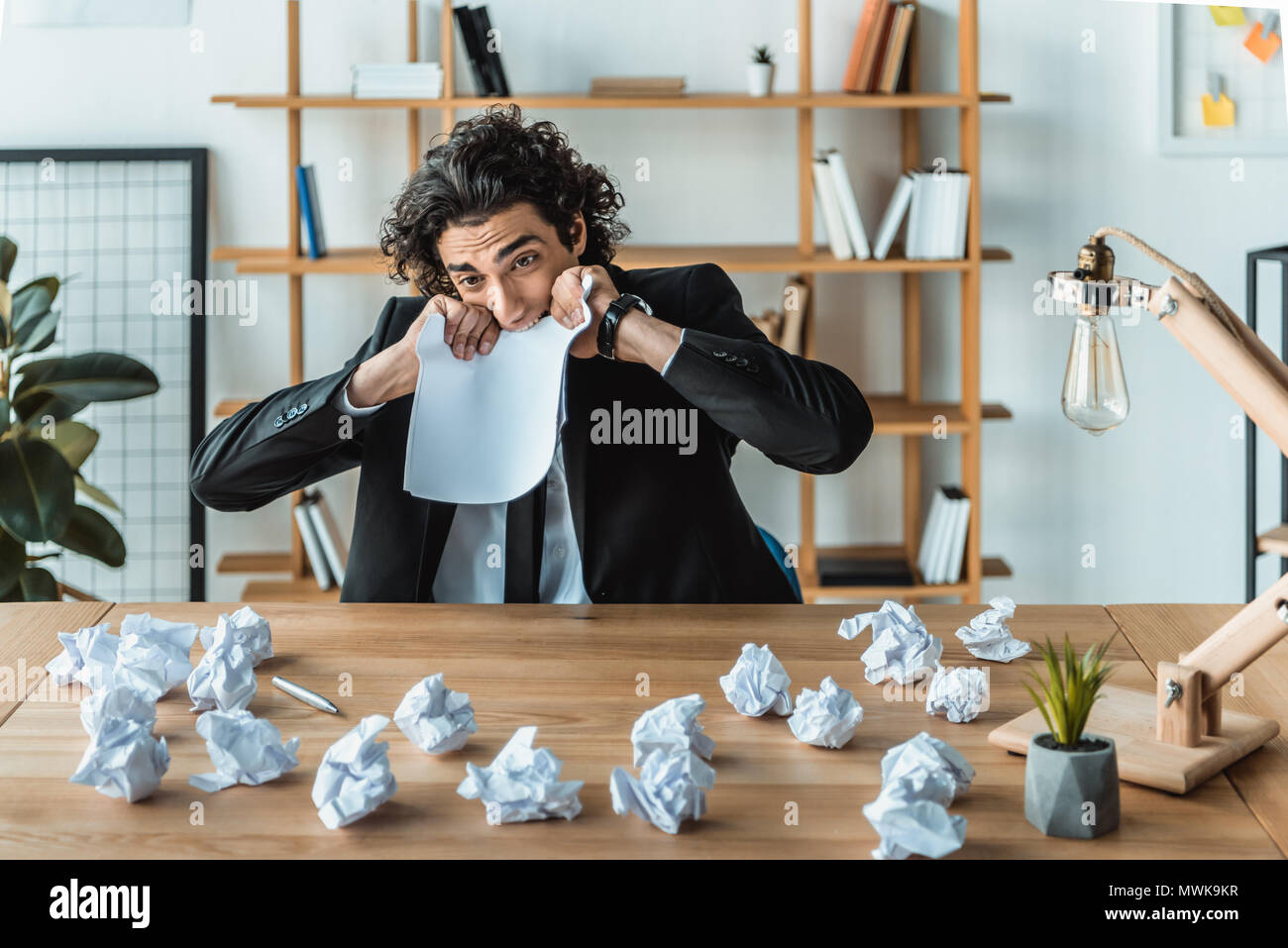 Man biting table hi-res stock photography and images - Alamy