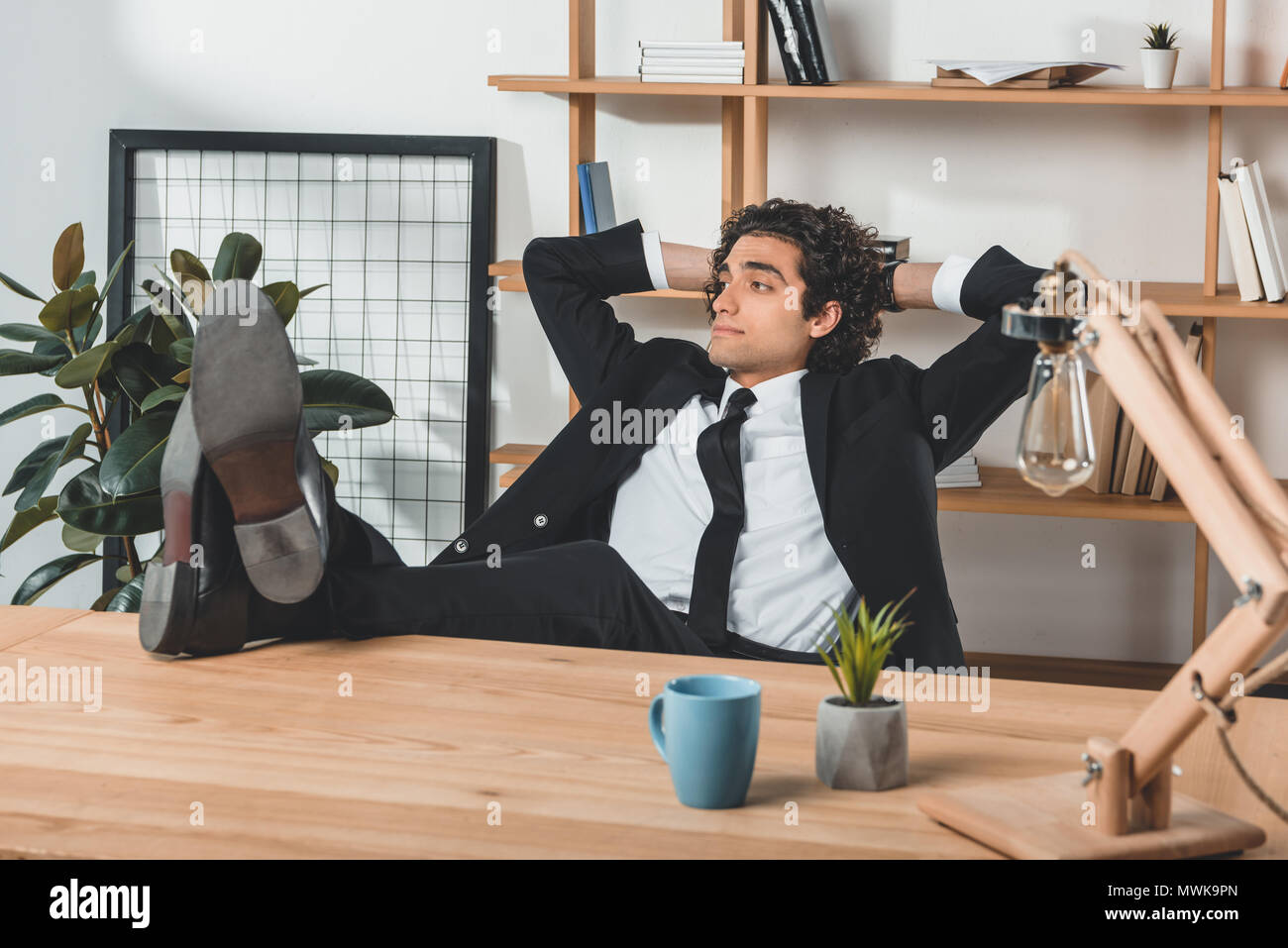 Arms resting on legs hi-res stock photography and images - Alamy