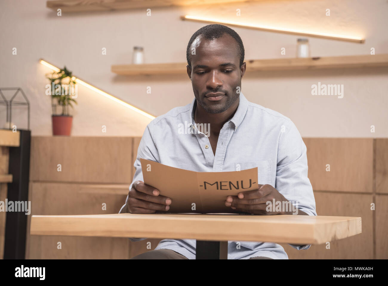 Guy looking at menu hi-res stock photography and images - Alamy