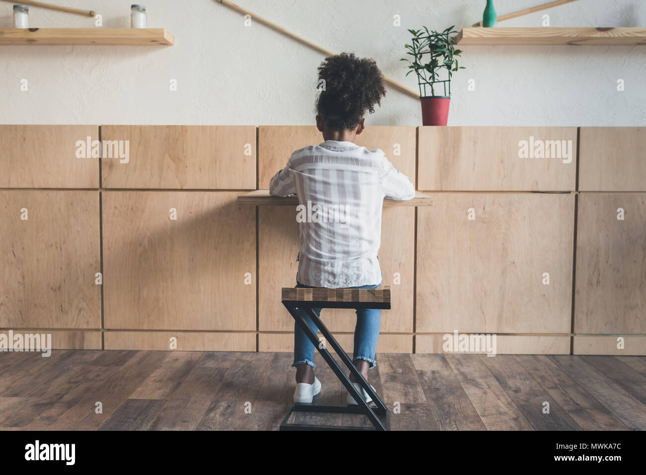 lonely african-american girl sitting in cafe Stock Photo - Alamy