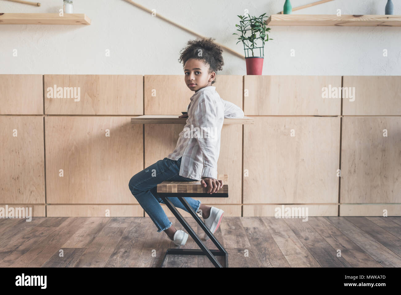 lonely african-american girl sitting in cafe Stock Photo - Alamy