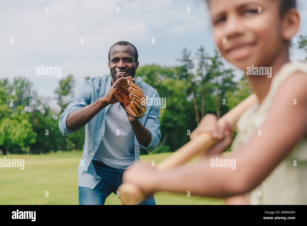 selective focus of smiling african american young man and little ...
