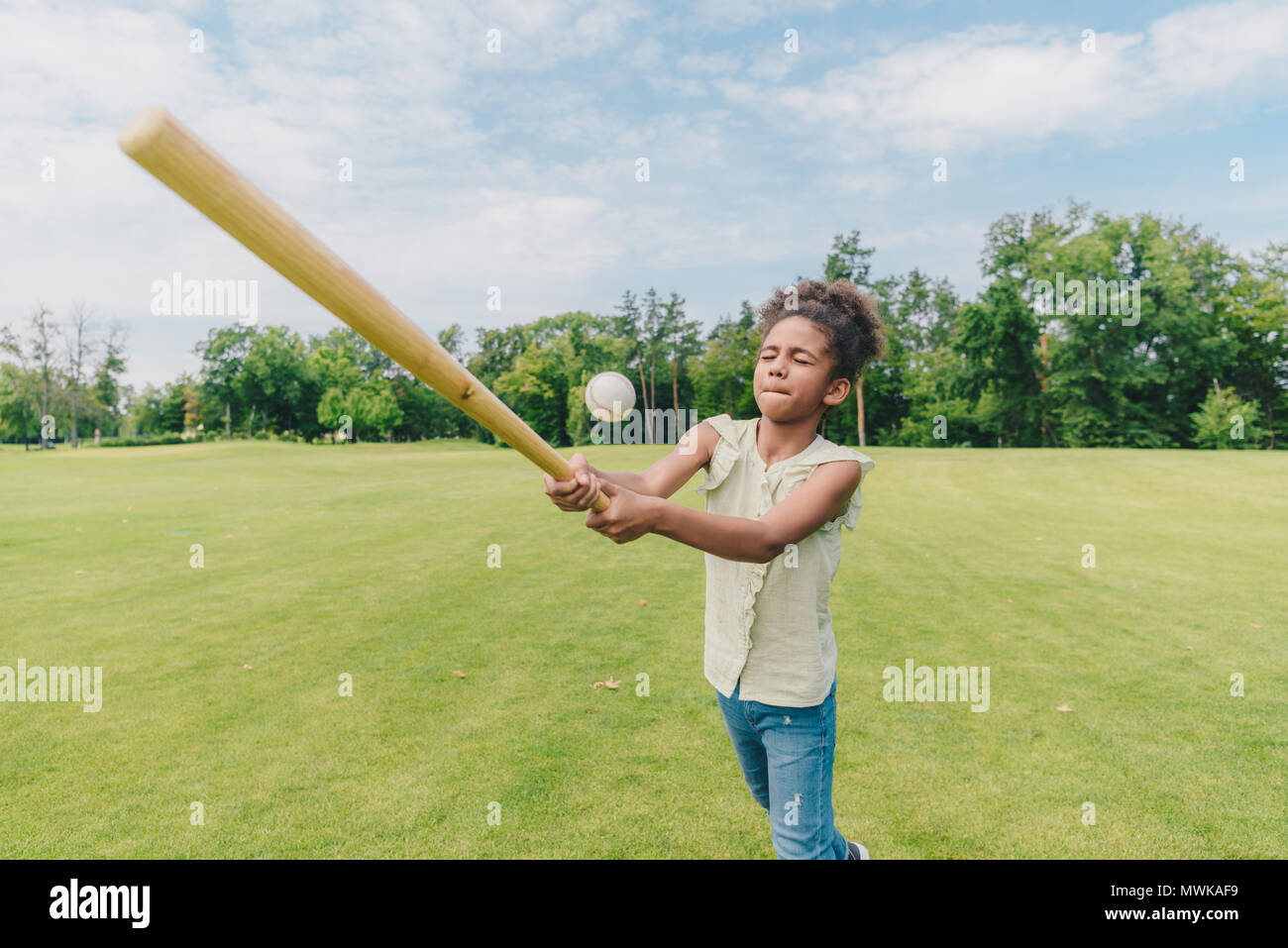 Girl baseball bat hi-res stock photography and images - Alamy