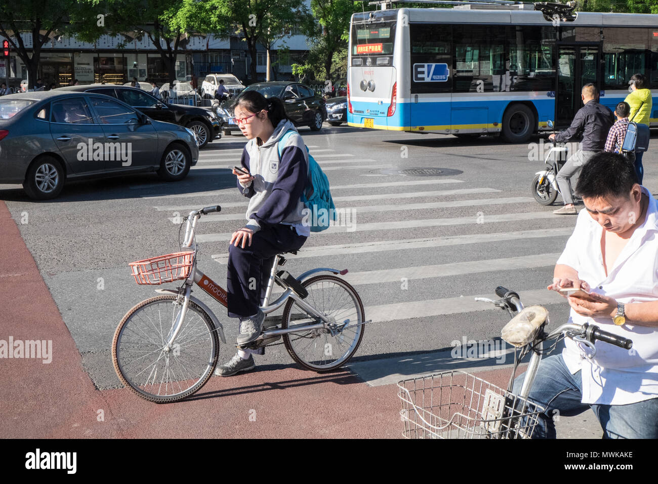 Commuter checking his mobile phone hi-res stock photography and images ...