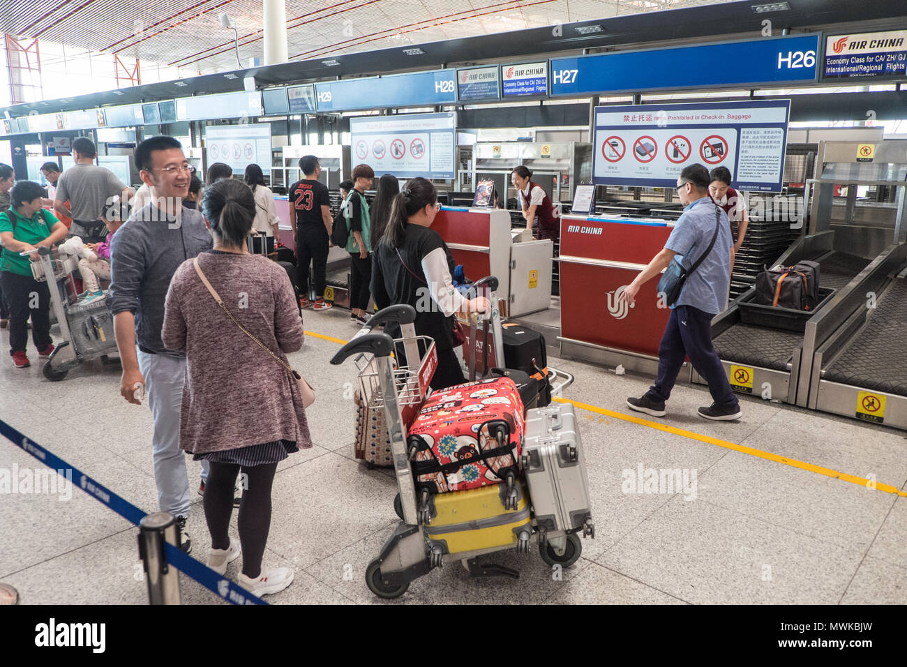 Check peoples bags hi-res stock photography and images - Alamy