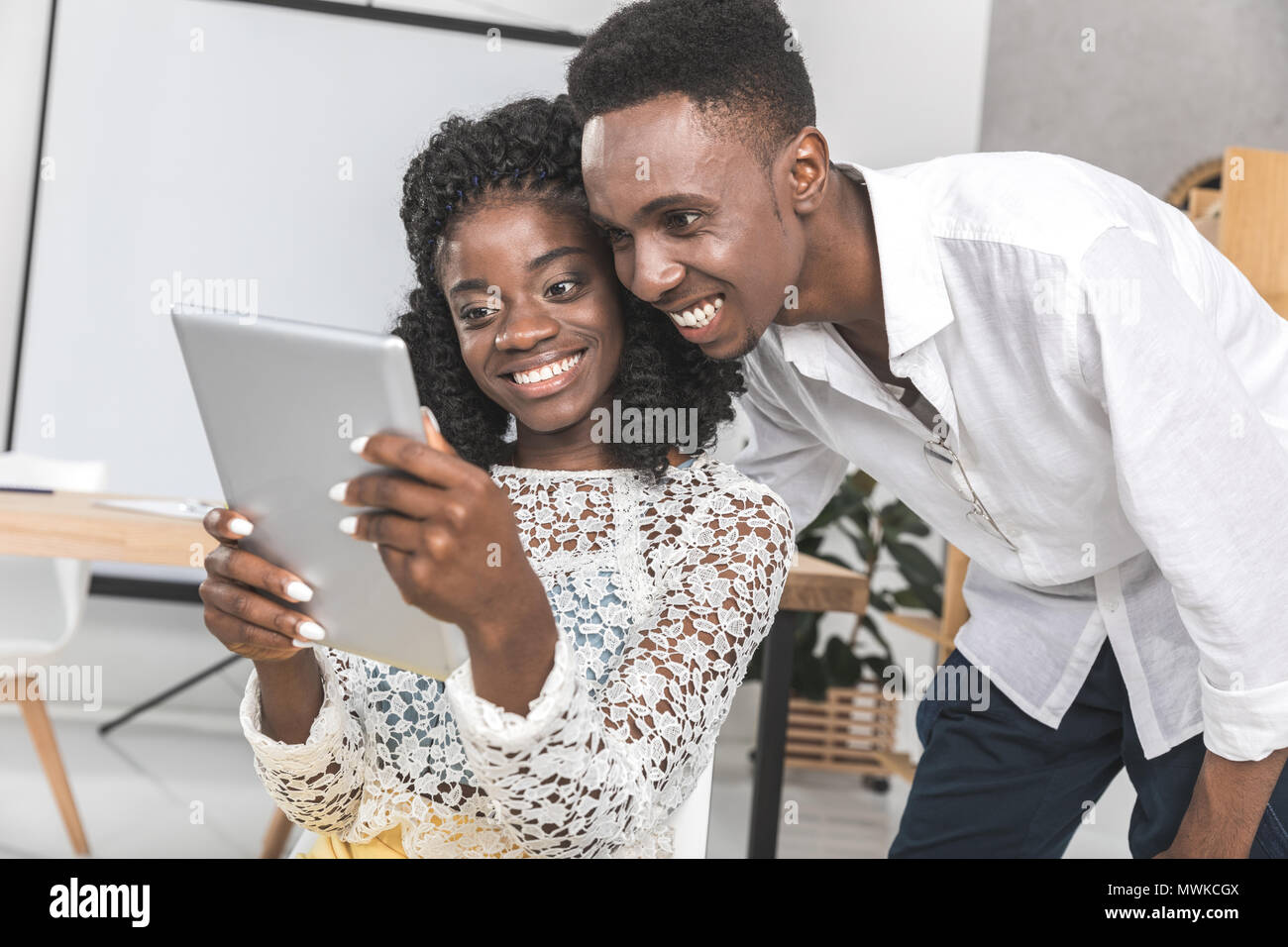 Business people using tablet together hi-res stock photography and ...