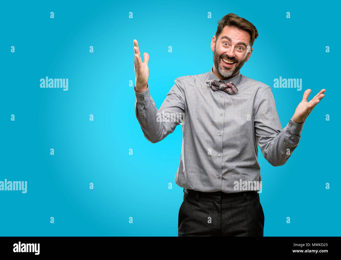 Middle age man, with beard and bow tie confident and happy with a big ...