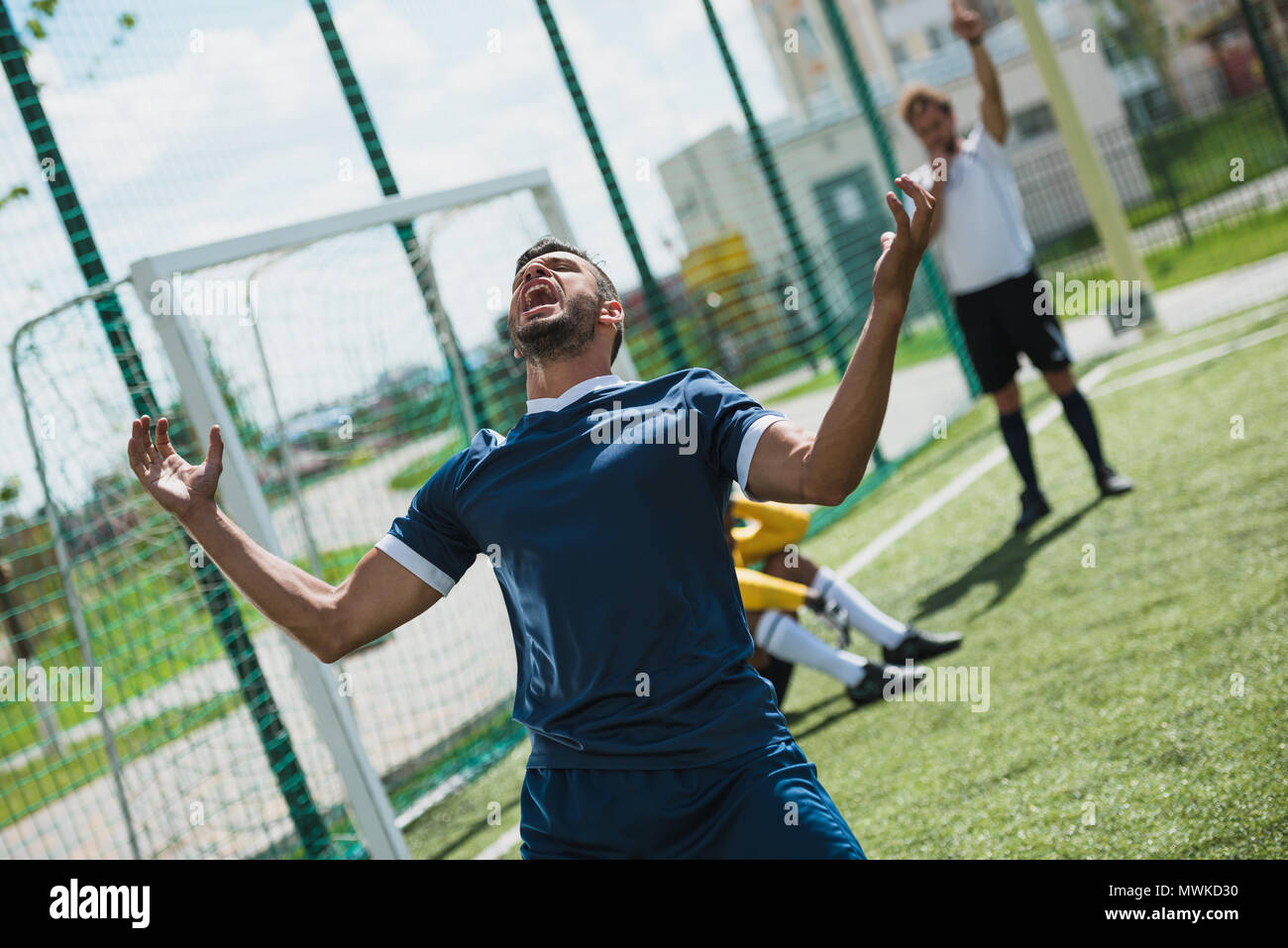 portrait of upset soccer player on soccer pitch during game Stock Photo ...