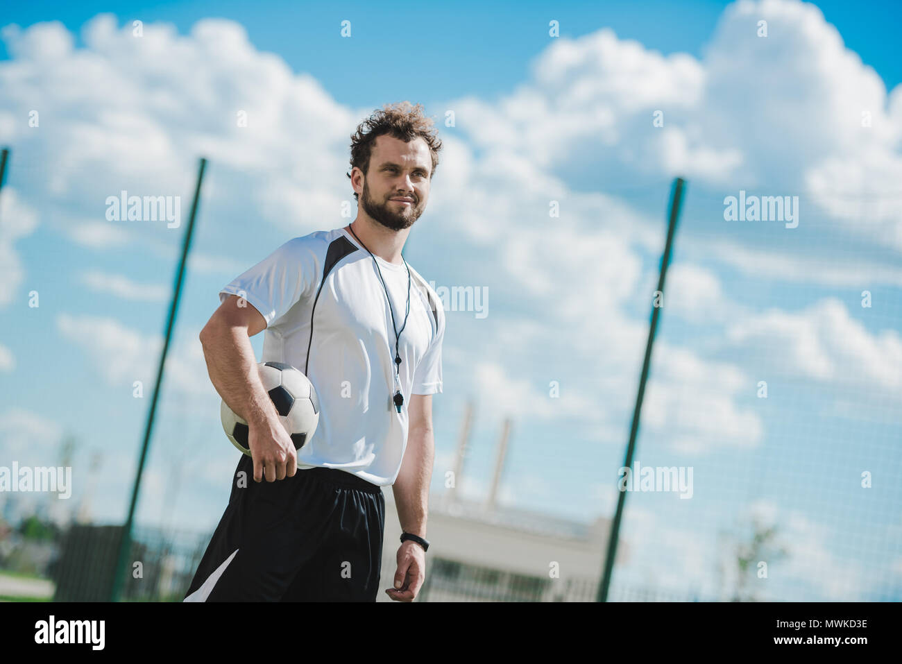 Referee holding ball hi-res stock photography and images - Alamy