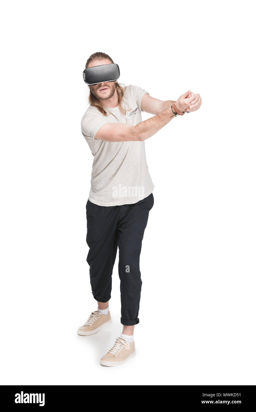 young man playing golf in virtual reality headset, isolated on white ...