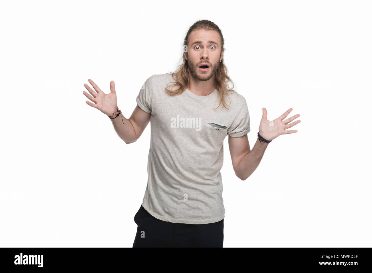 shocked young man looking at camera, isolated on white Stock Photo - Alamy