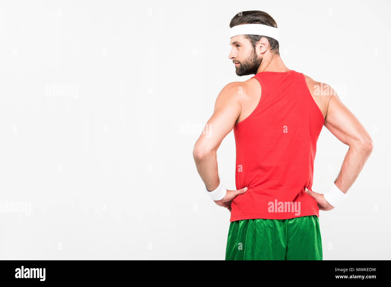 back view of sportsman posing in retro sportswear, isolated on white ...