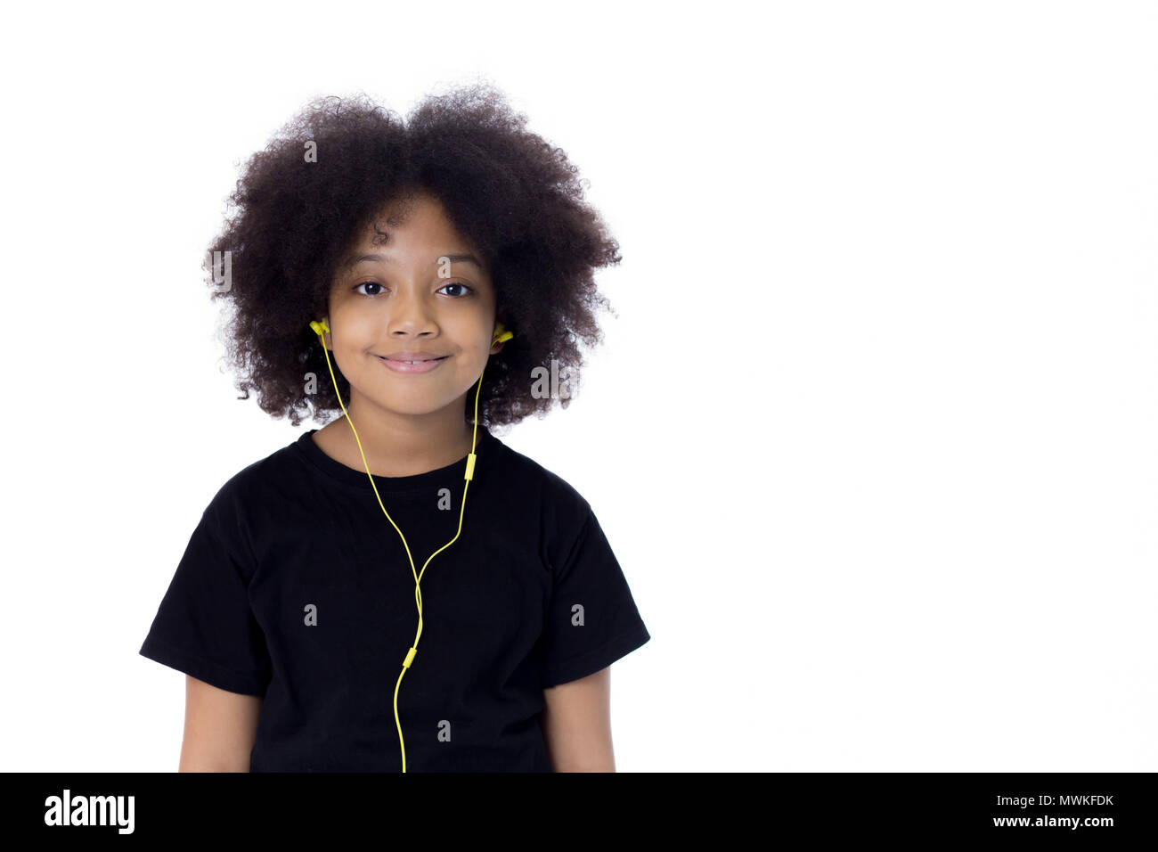 African American afro kid listening the music with earphones - in white ...