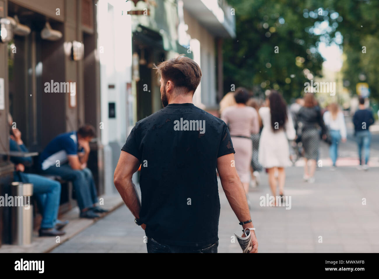 A man is walking down the street Stock Photo - Alamy